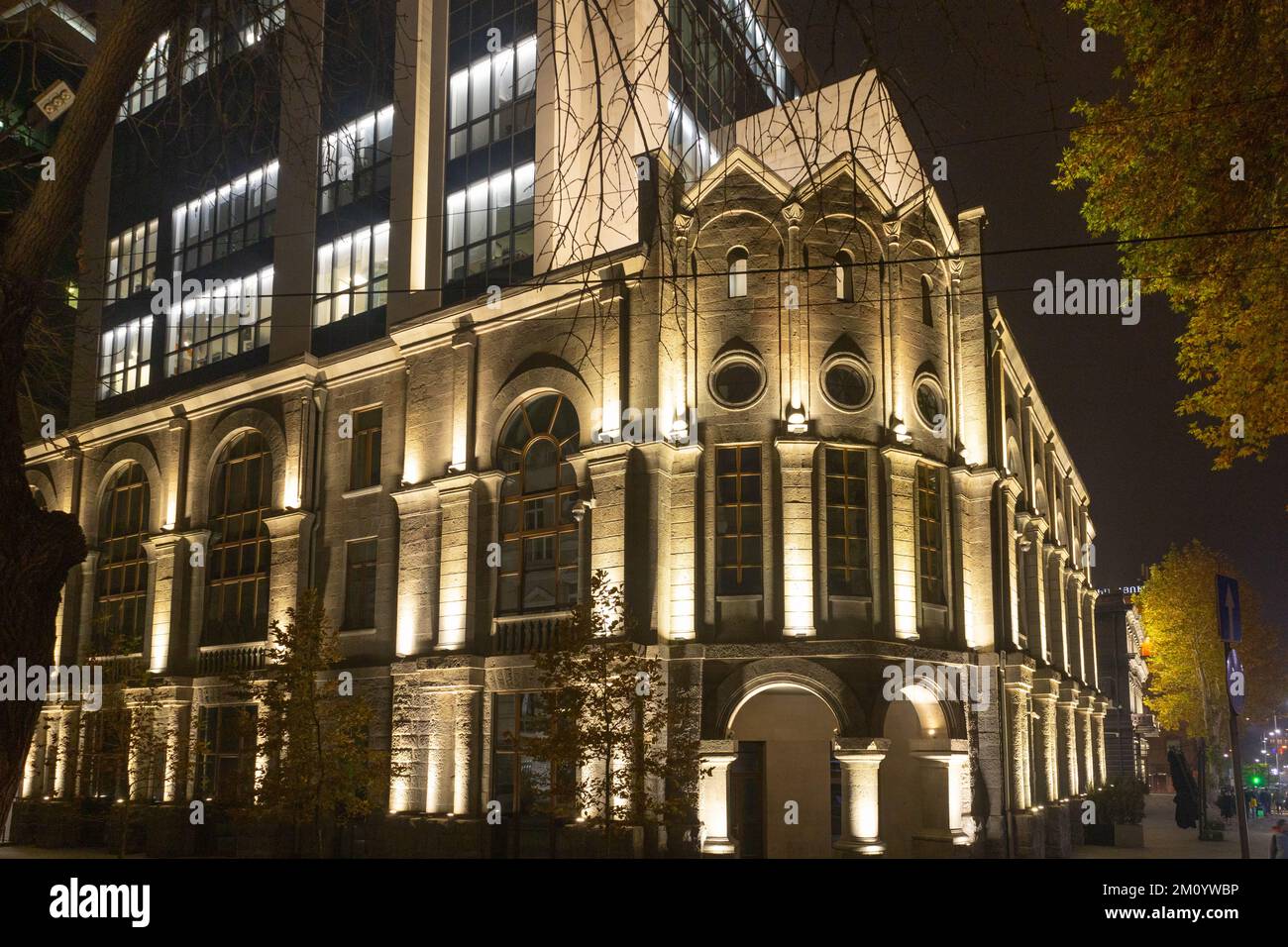 Modern office building constructed above an old historic building ...