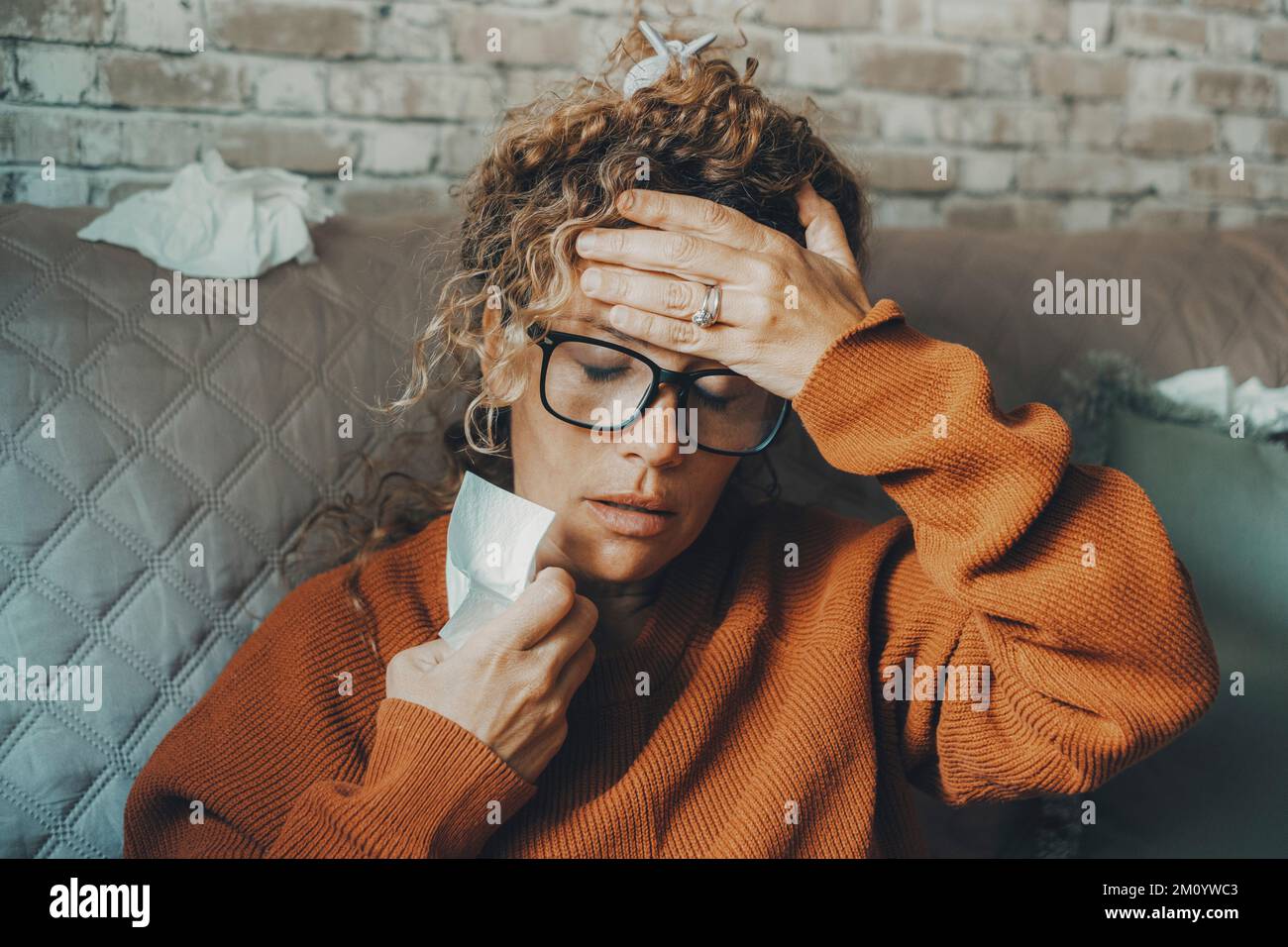 Bad health condition woman touching his front for fever symptoms. One ...