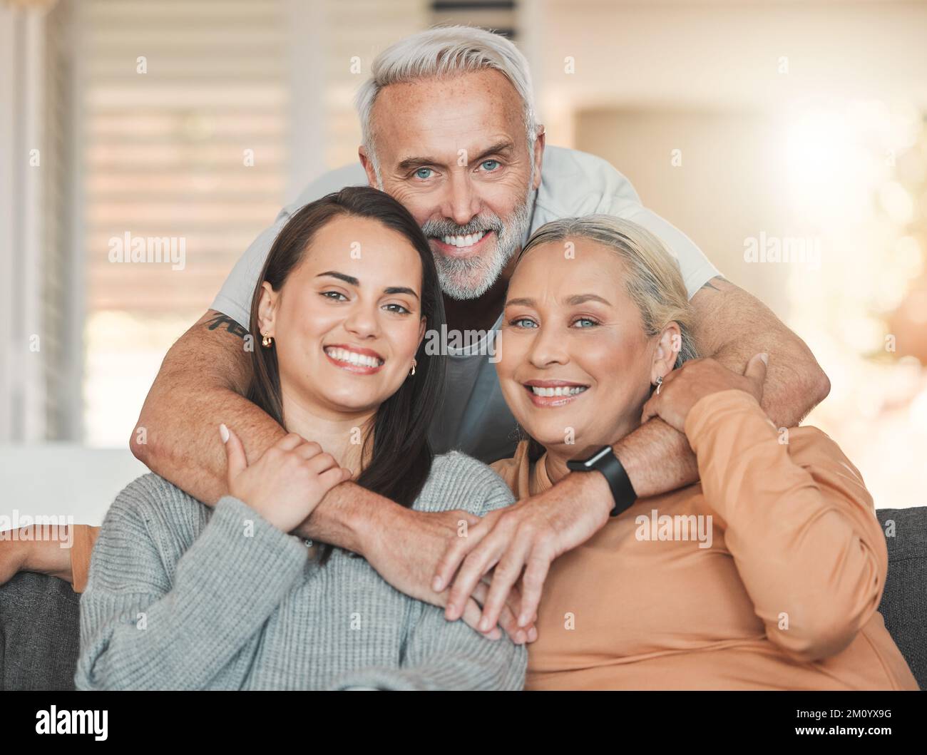 Nothings more important than family. a woman sitting on a couch with ...