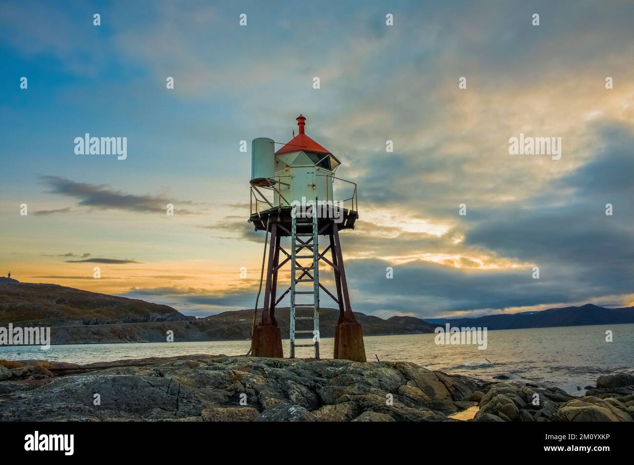 the Fuglenes lighthouse in Norway, on the background of the sunrise ...