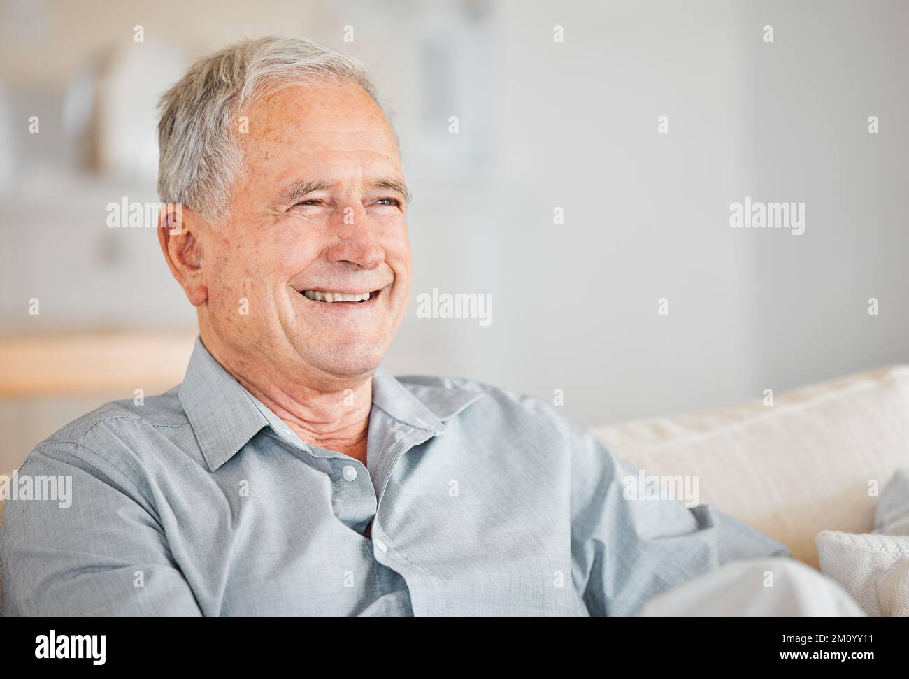 I just love reminiscing about the good old days. a senior man looking ...