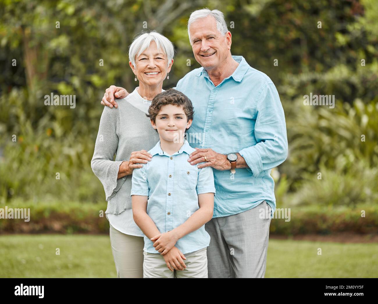 Our grandson is our shining star. a senior couple standing outside with ...