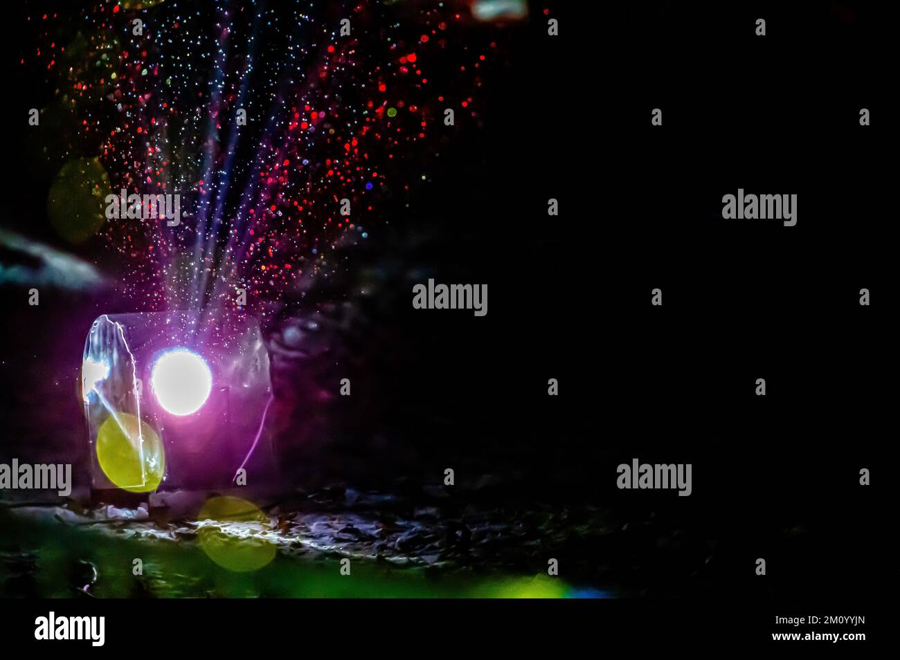 spotlight with beams of light at an outdoor light show in a park Stock ...