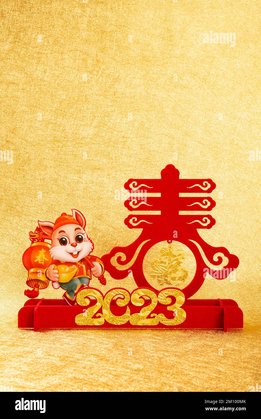 Chinese New Year of Rabbit mascot on golden background at vertical ...