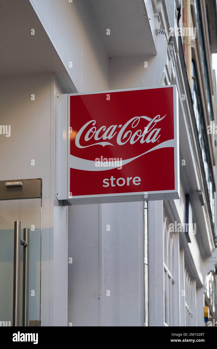 Wall mounted sign above shopfront of the Coca Cola store. Covent Garden ...