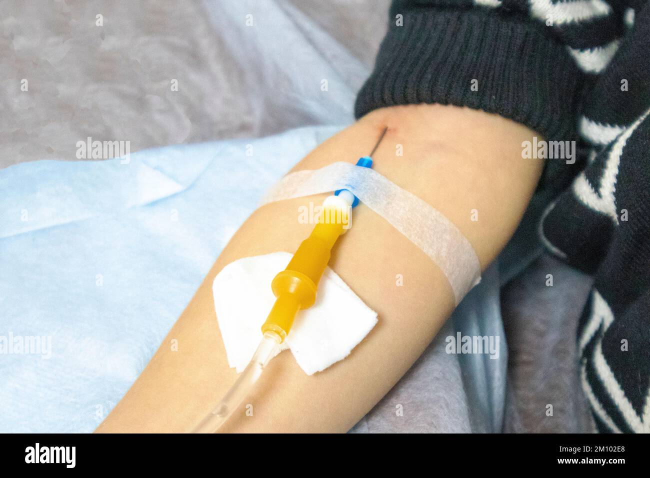 hand close-up with a needle and a dropper. the procedure in the ...