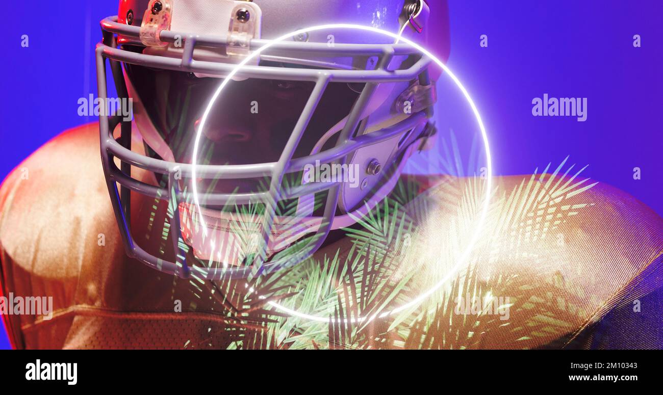 Close-up of illuminated plants and circle over american football player ...