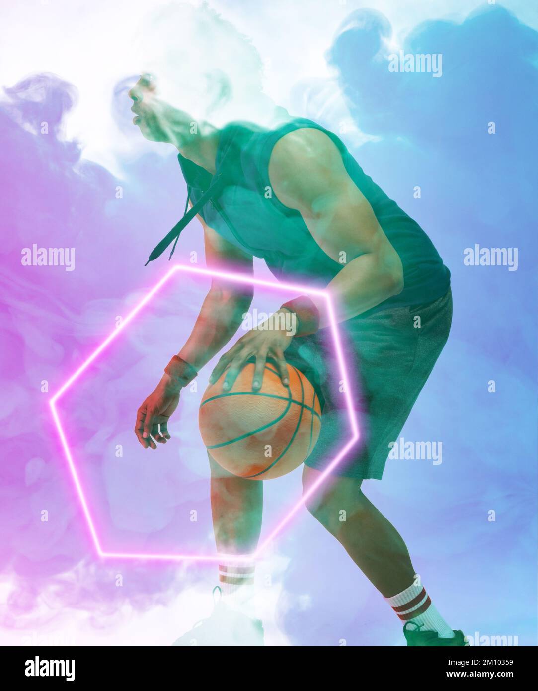 African american male player dribbling basketball by illuminated ...