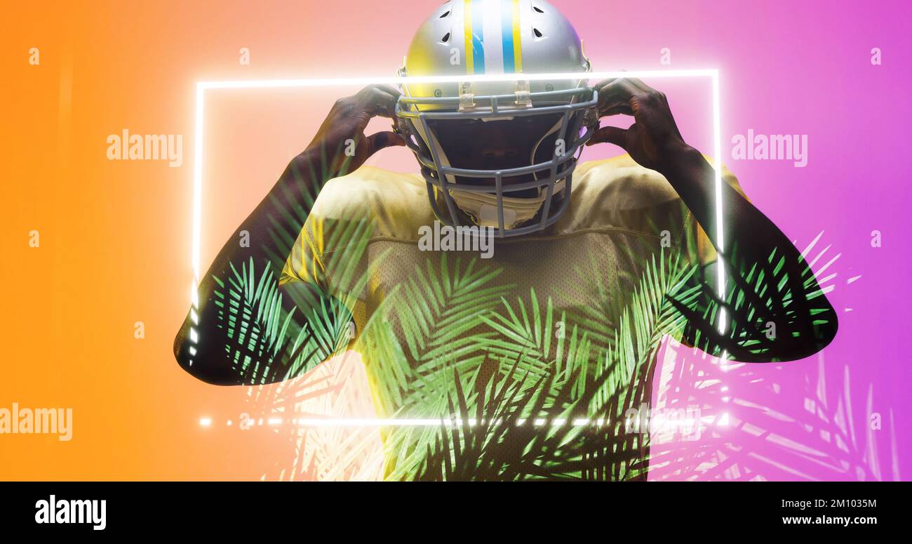 Composite of american football player wearing helmet by illuminated ...