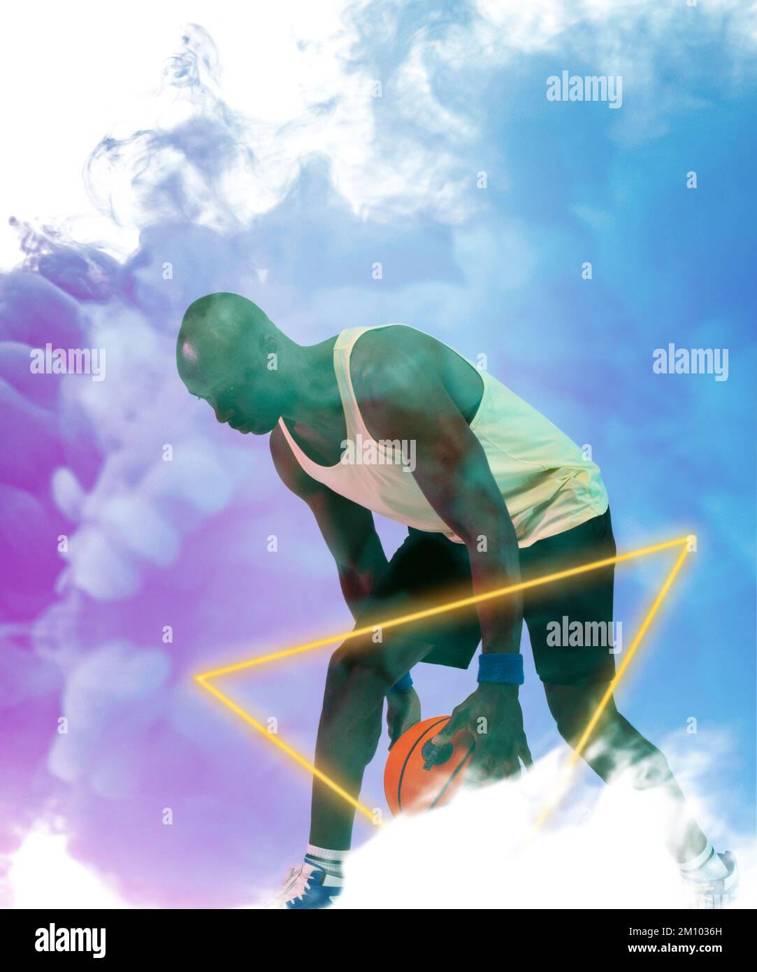 African american male player dribbling basketball by illuminated ...