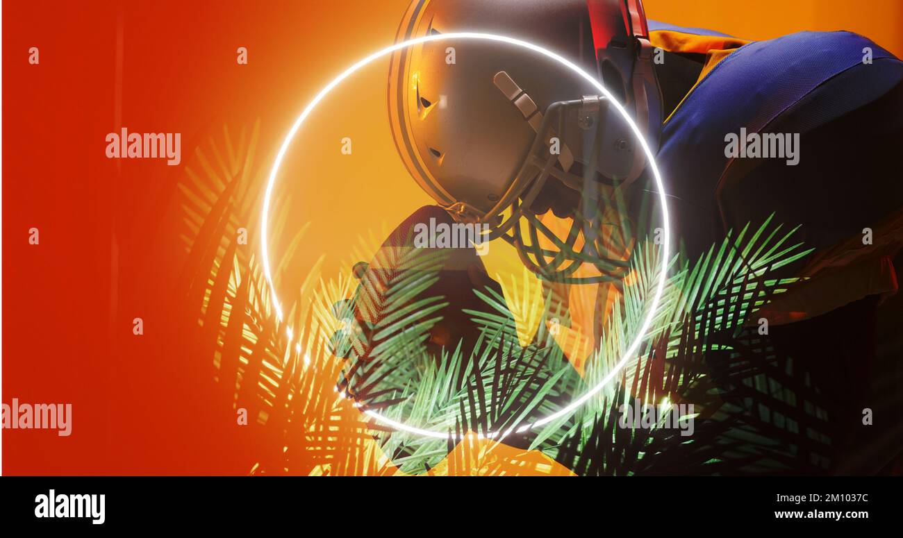 Stressed american football player wearing helmet and holding ball by ...