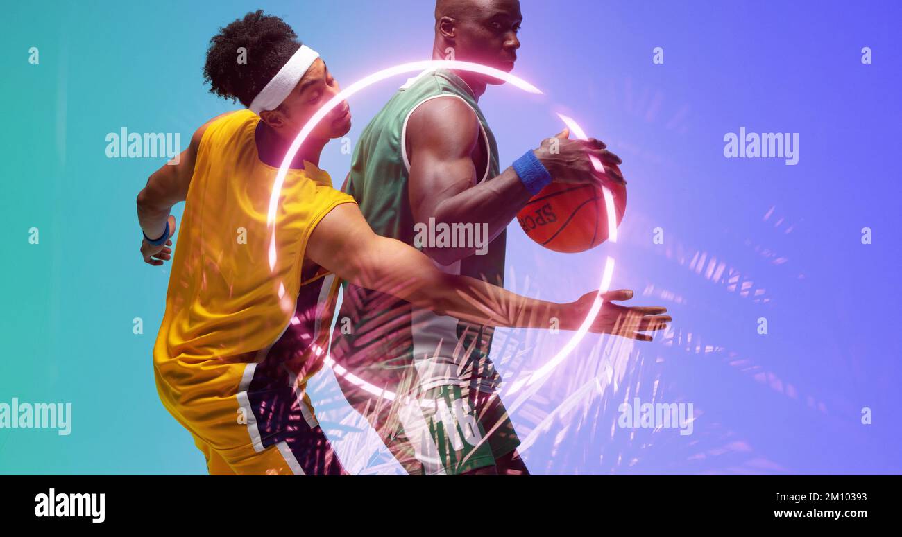 African american basketball players defending ball from opponent by ...