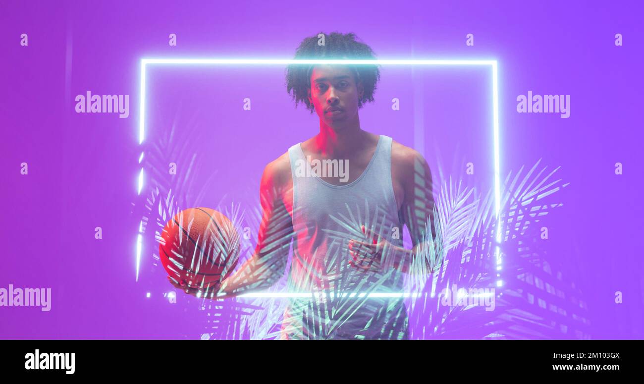 Composite of biracial basketball player with afro hair holding ball by ...