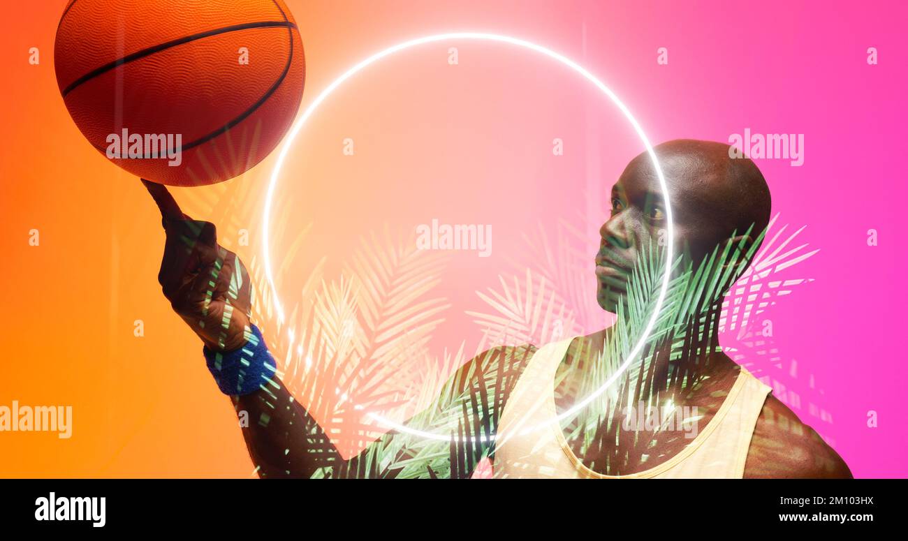 Bald african american basketball player spinning ball on finger by ...