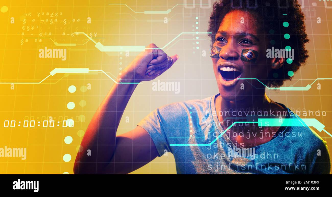 Biracial soccer player with brazilian flag's face paint screaming on ...