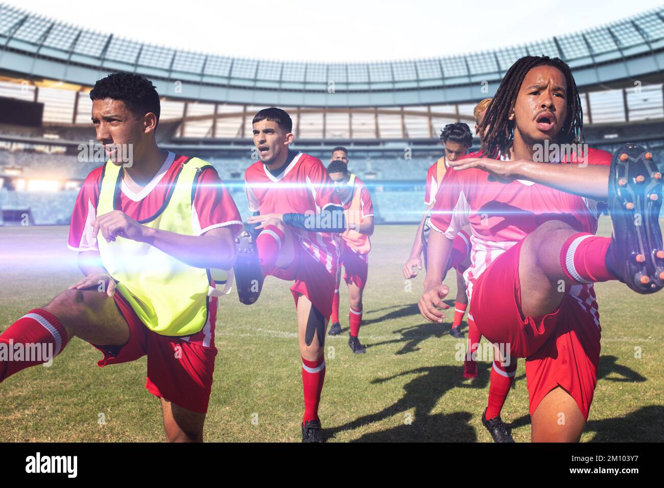 Determined team of multiracial male soccer players in sports clothing ...