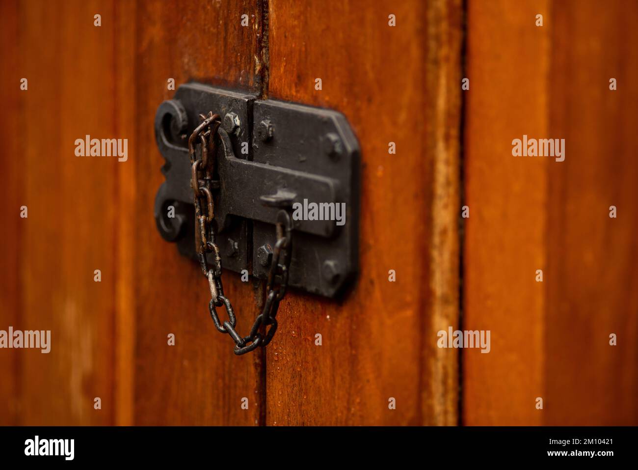 Black old-style lock on wooden door Stock Photo - Alamy