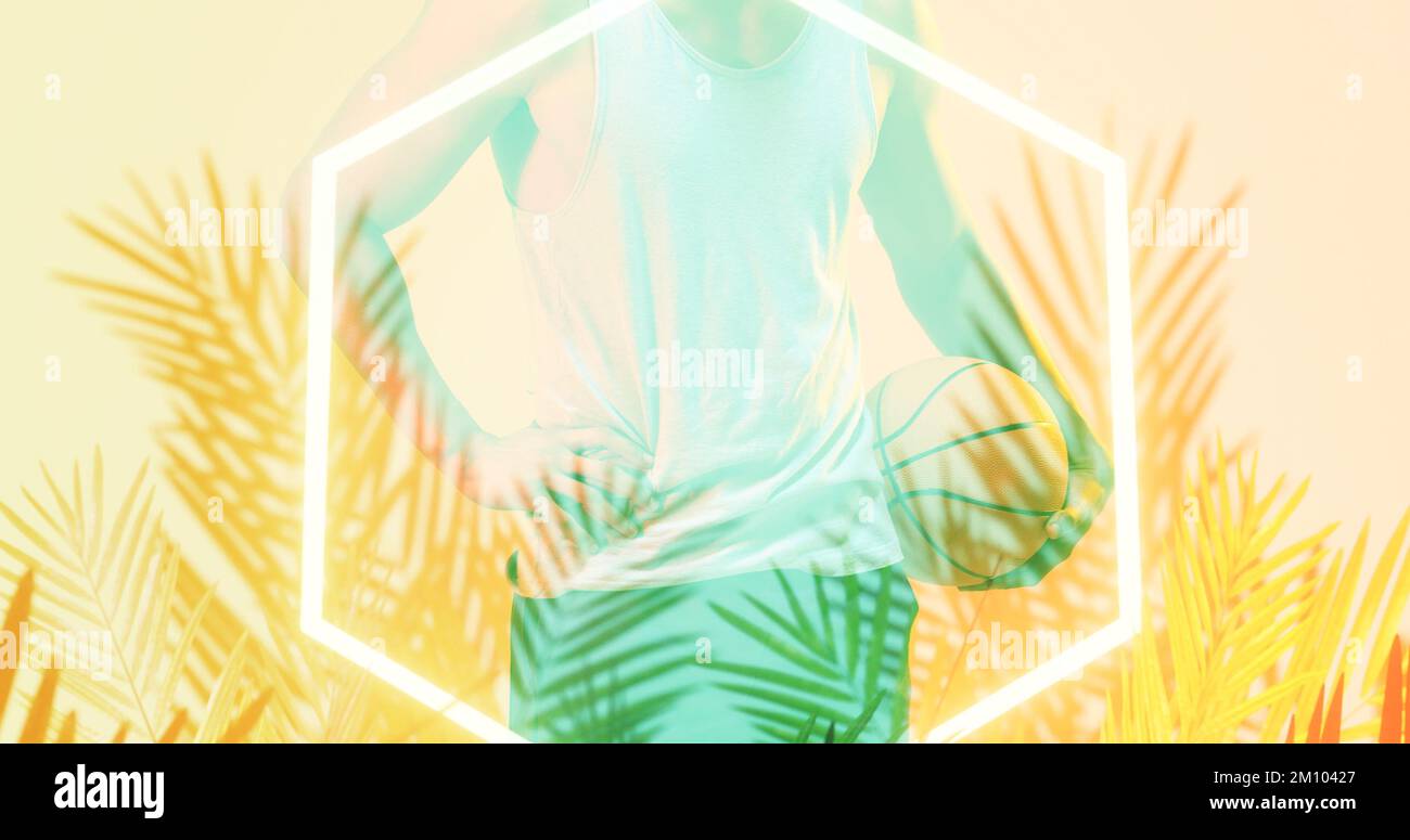 Multiple exposure of male basketball player and plants with hexagon ...