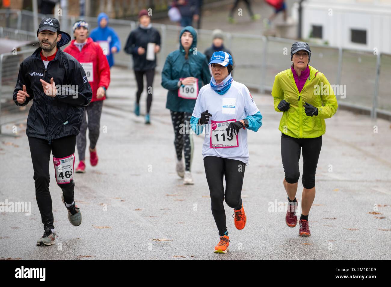 Athletes running under the rain in occasion of the Telethon marathon ...