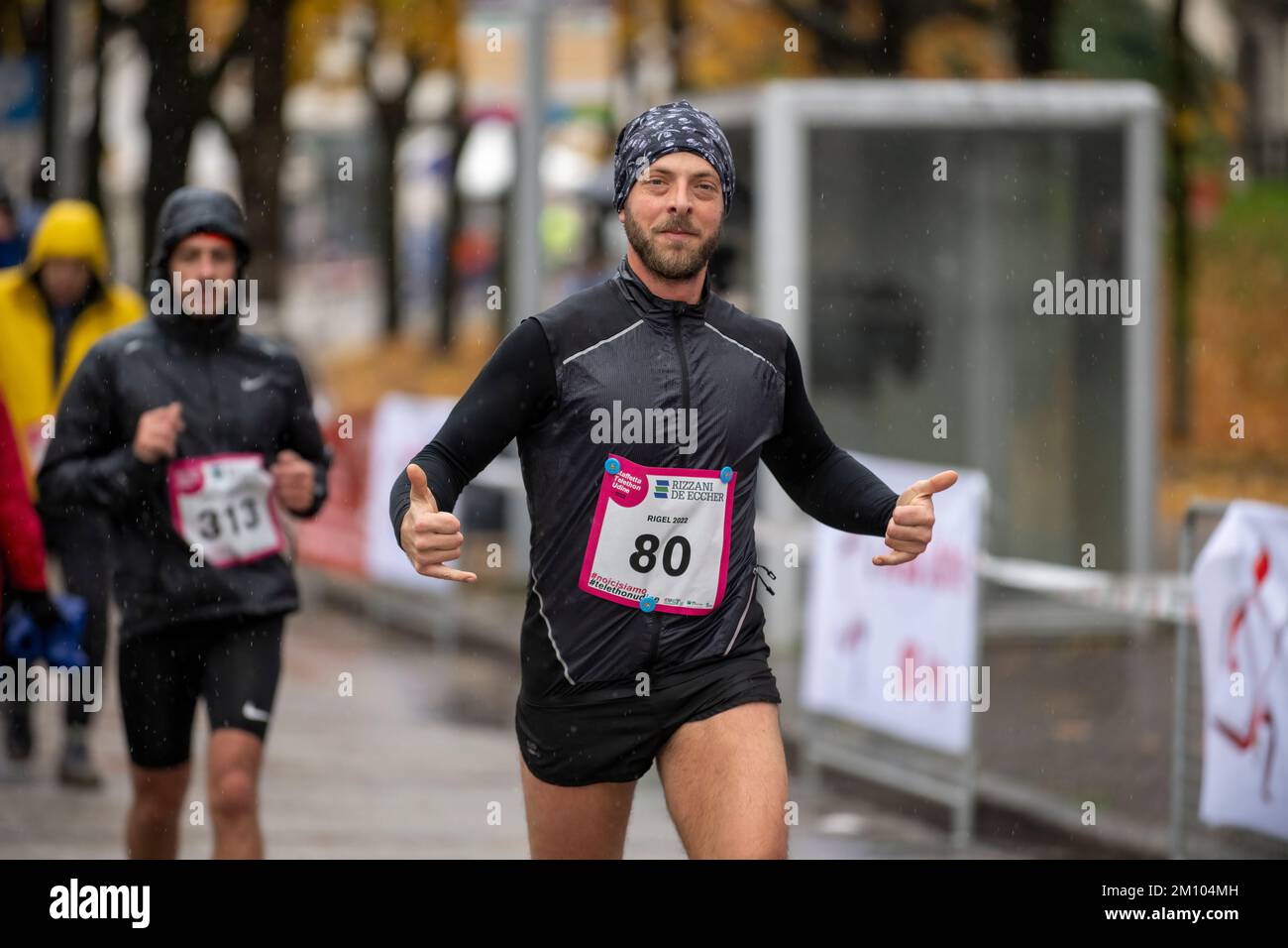Athletes running under the rain in occasion of the Telethon marathon ...