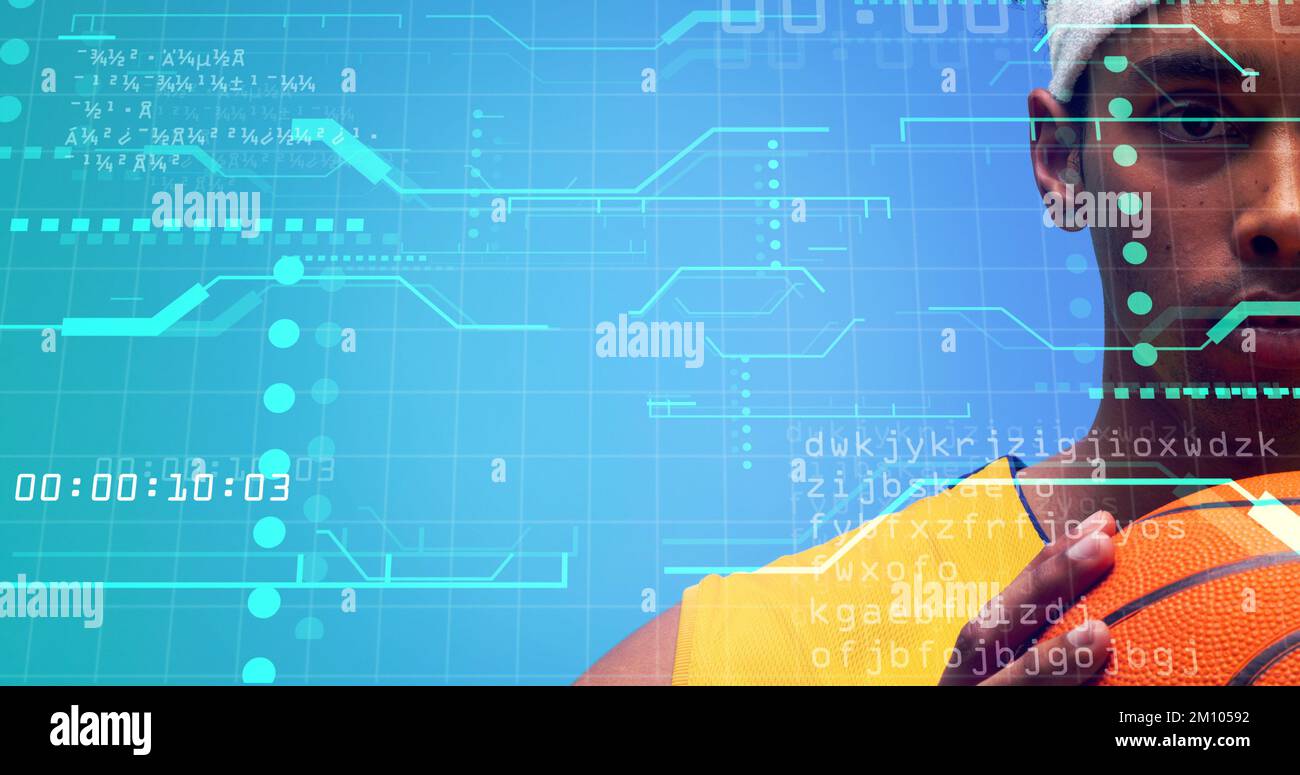 Close-up of biracial basketball player holding ball over grid pattern ...