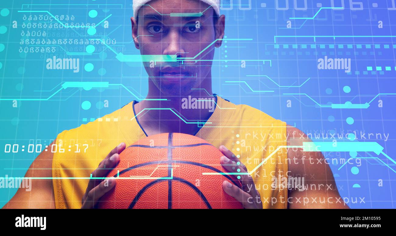 Portrait of biracial basketball player holding ball over grid pattern ...
