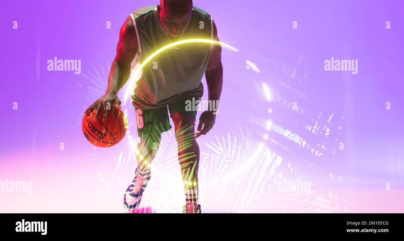 African american basketball player dribbling ball by glowing circle and ...
