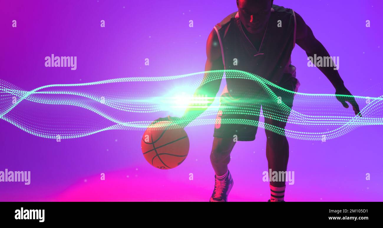 African american basketball player dribbling ball by wave patterned ...