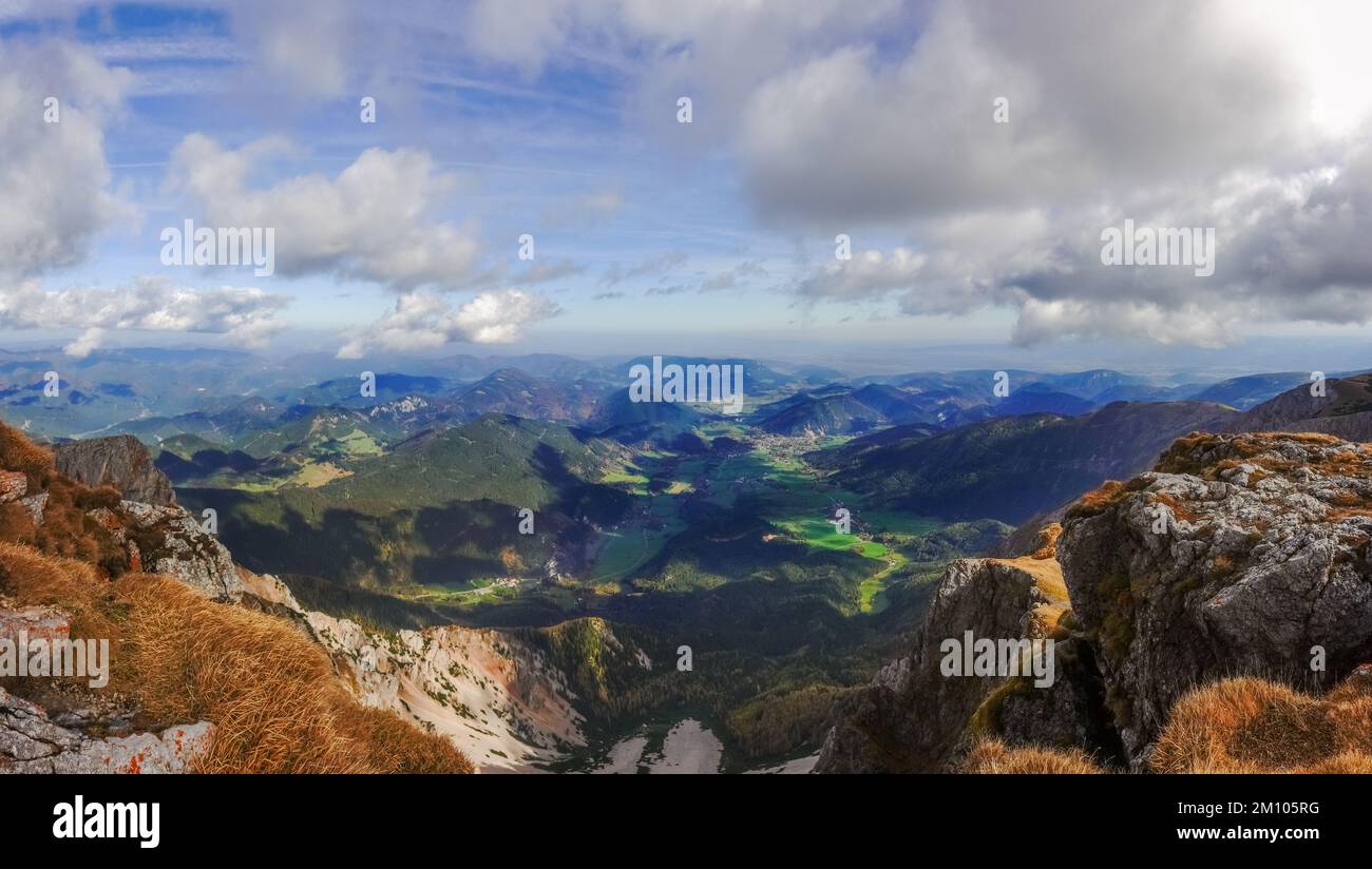 amazing wide view to a hilly mountain landscape and amazing sky during ...