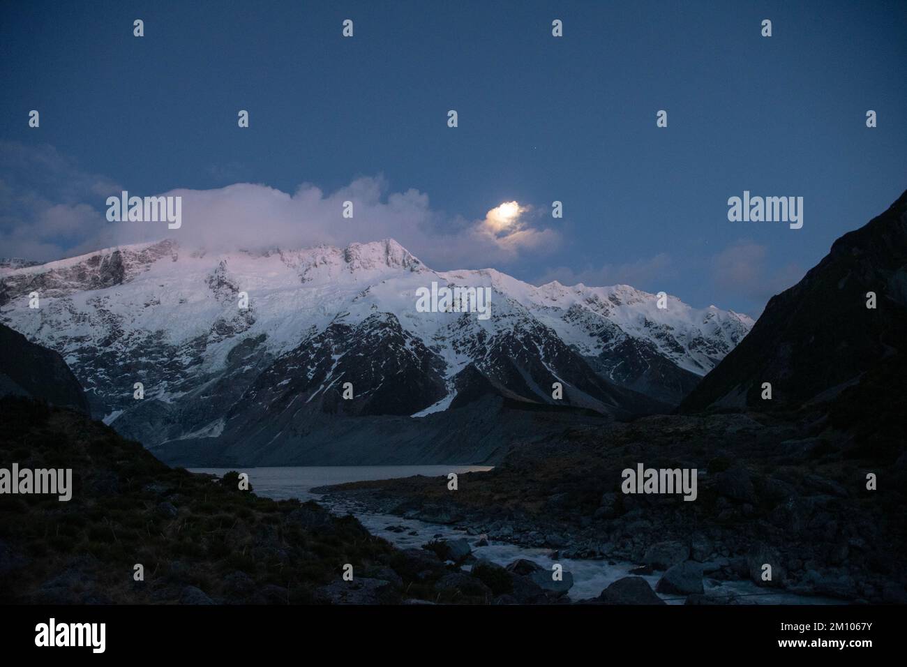 Moon over mountain range in Mt Cook Village Stock Photo - Alamy