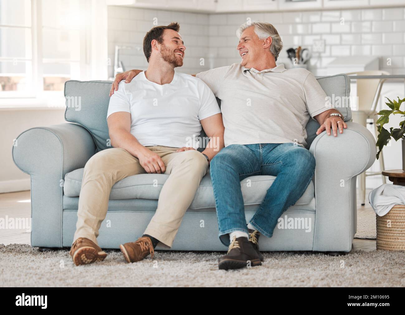 The only rock I know that stays steady. a father and son sitting on the ...