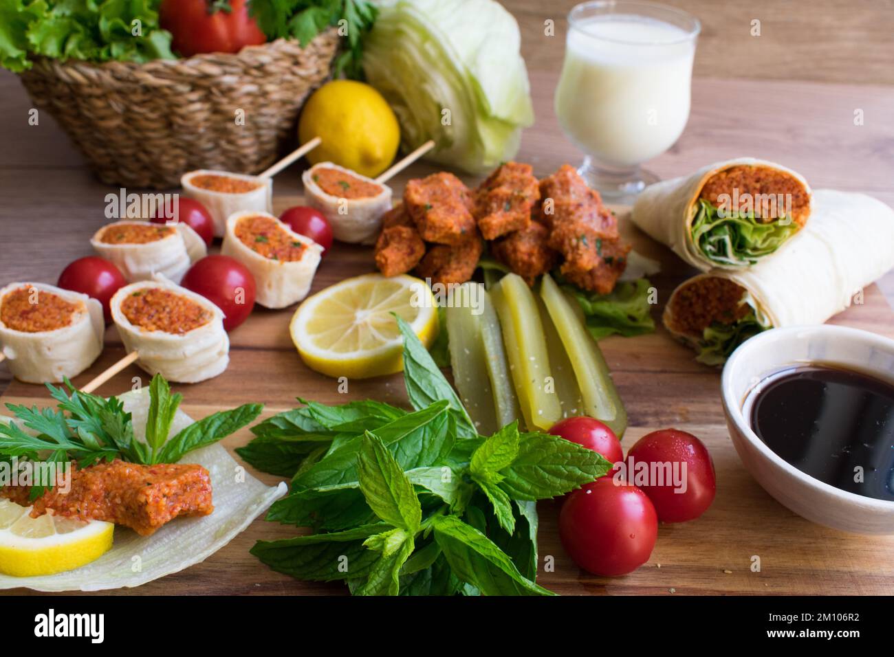 Turkish "cig kofte”, close-up Turkish meatballs cut into lettuce ...