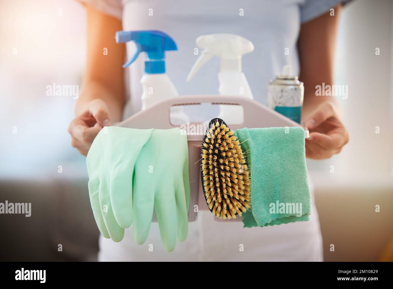 Woman, hands or cleaning container with spray bottle, rubber gloves or ...