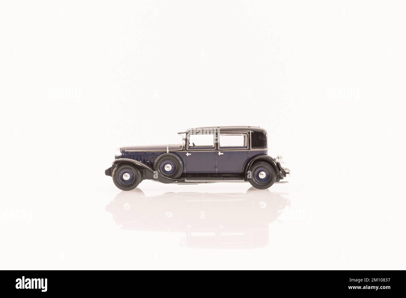 Antique model car convertible in blue and black colors Stock Photo - Alamy