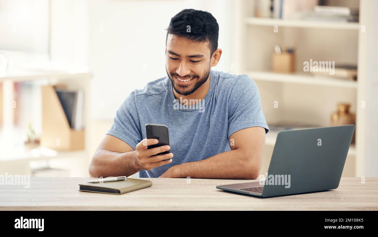 Making new connections every second. a young businessman using a phone ...