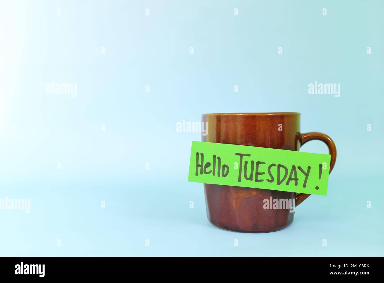 Welcome, hello and happy Tuesday concept. Selective focus of coffee cup ...