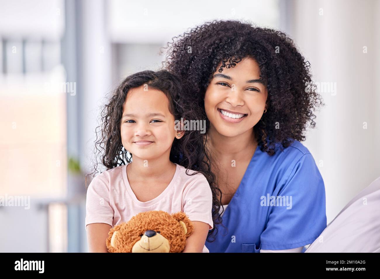 Getting her yearly check-up. an adorable little girl having a checkup ...