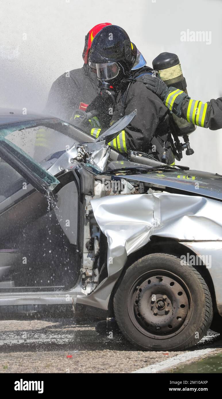 fire brigade team in action during the rescue of the injured person ...