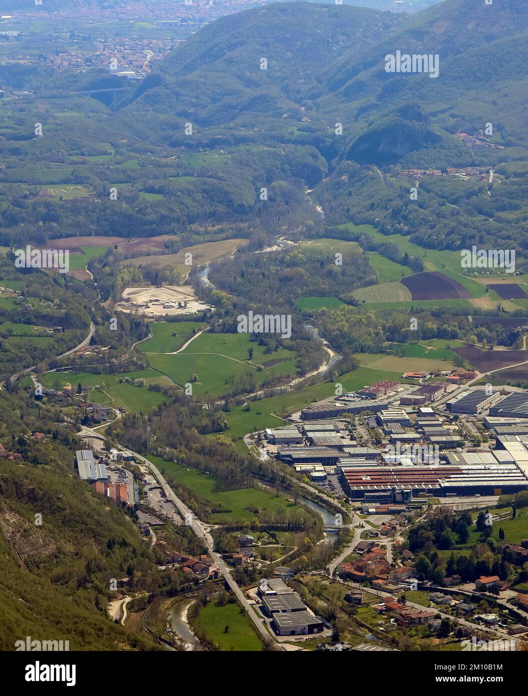 Aerial view of the valley with the industrial area with factories and ...