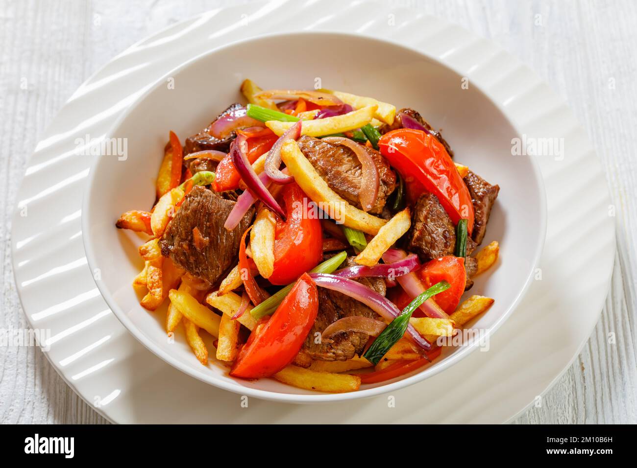 Lomo saltado, Peruvian dish of stir-fried slices of beef sirloin ...