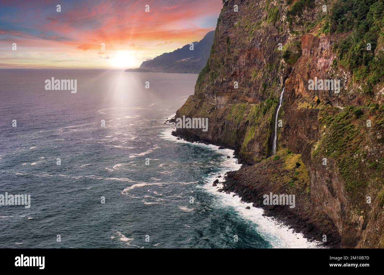 Madeira island - Dramatic sunrise over atlantic ocean with waterfall ...