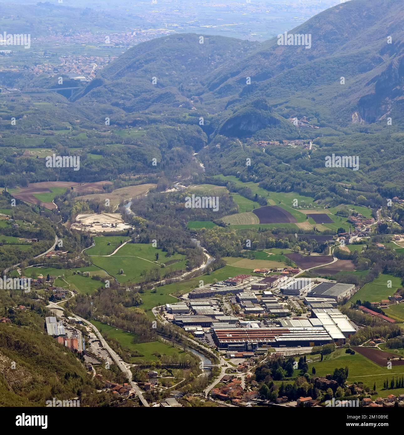 Aerial view of the valley with the industrial area with factories and ...