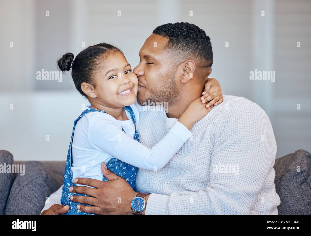 Father kissing daughter on cheek hi-res stock photography and images ...
