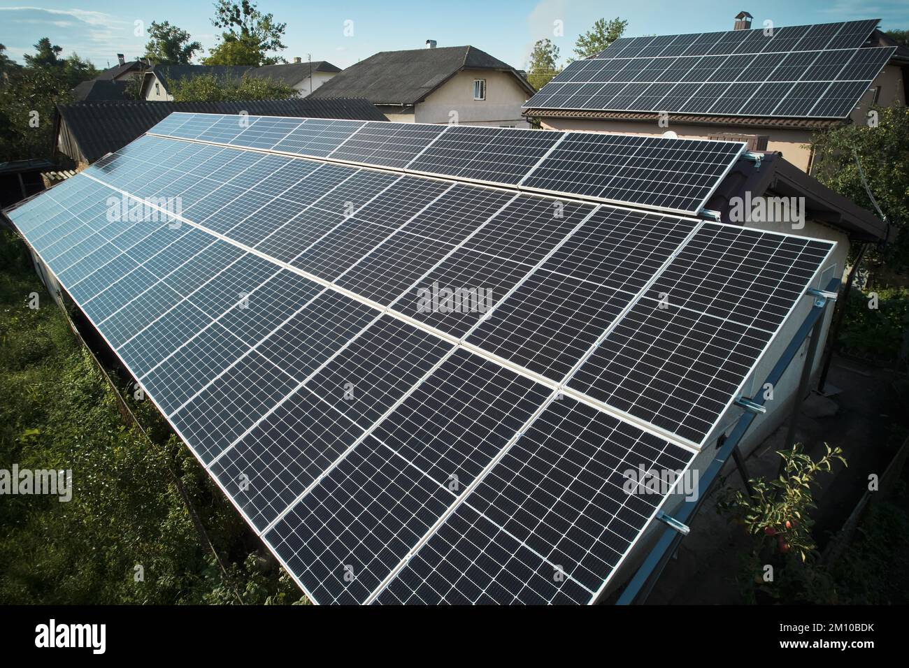 Aerial top view of new modern house cottage with solar photovoltaic ...
