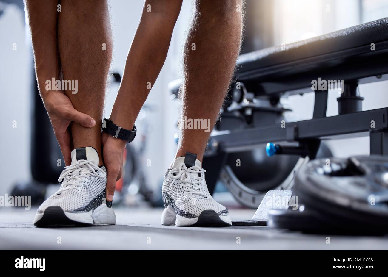 Man legs, fitness and ankle injury in gym for training workout, sports ...