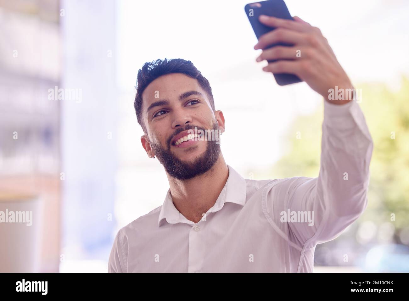Businessman, phone and smile for selfie, profile and social media post ...