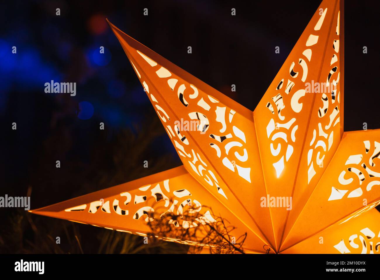 Decorative paper star with traditional ornaments and inner illumination ...
