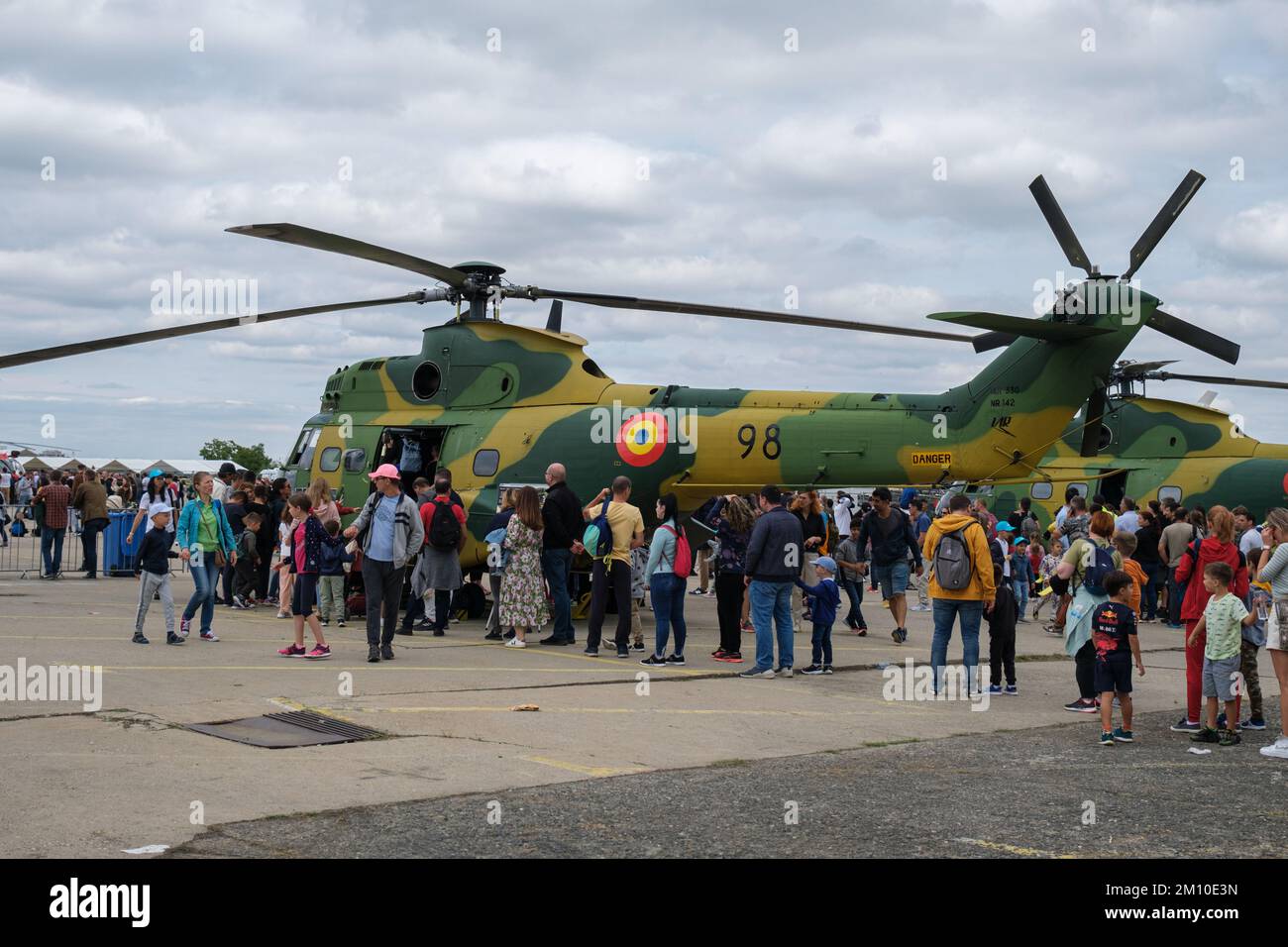 A green IAR 330 aircraft and a crowd at Bucharest International Air ...