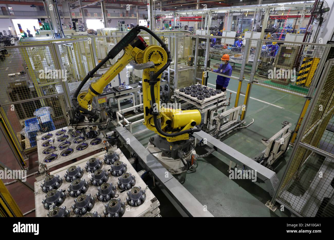 ANQING, CHINA - DECEMBER 9, 2022 - Several "robot arms" work on the ...