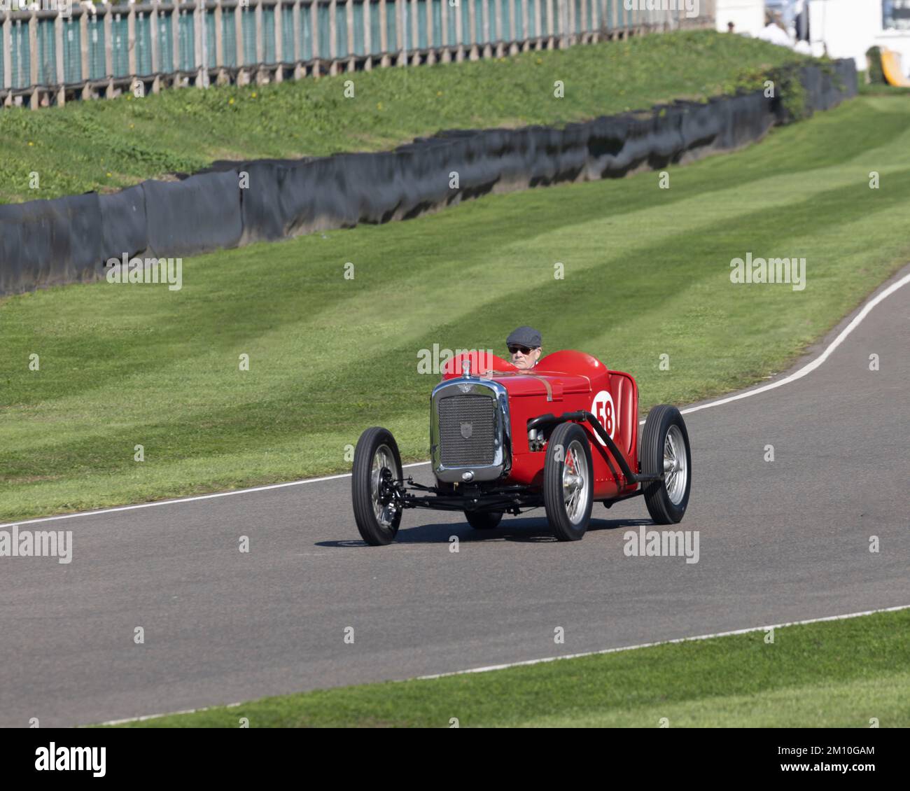 A red Austin Seven sports racing car at the 2022 Goodwood Revival Stock ...